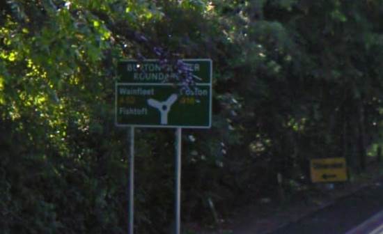 What is sign clutter and how does it get reduced?