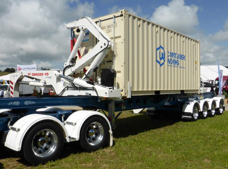 How are containers attached to lorries?