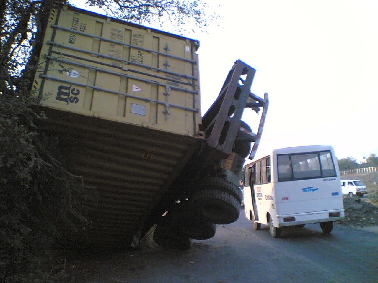 How are containers attached to lorries?