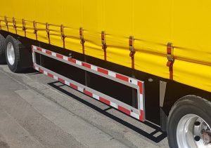 What are lateral protection devices and side underrun protection?